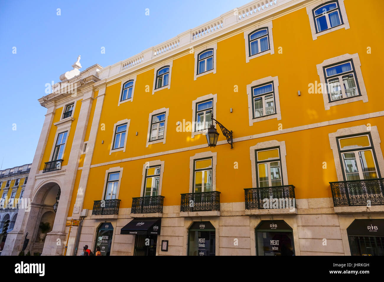 The yellow buildings at Comercio Square in Lisbon - LISBON, PORTUGAL ...