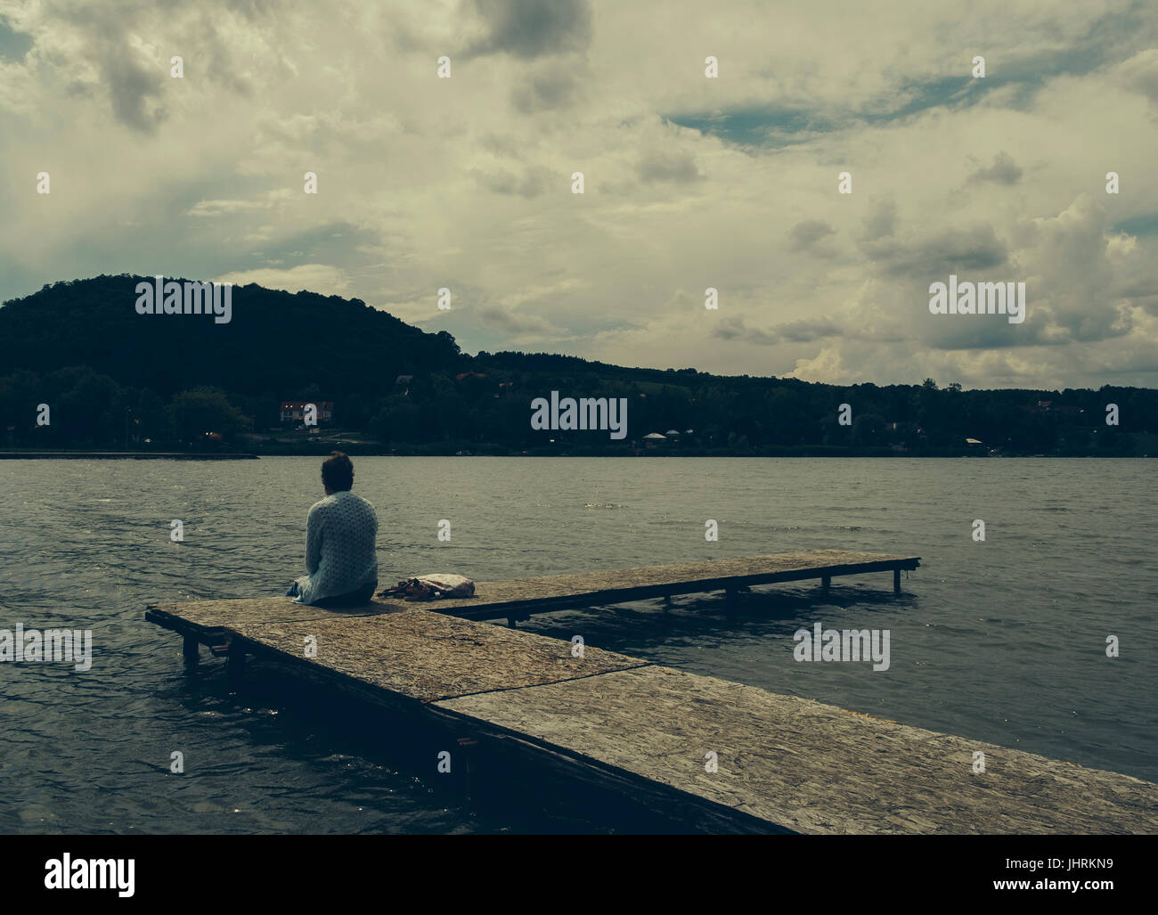 Sad woman at the lake Stock Photo - Alamy