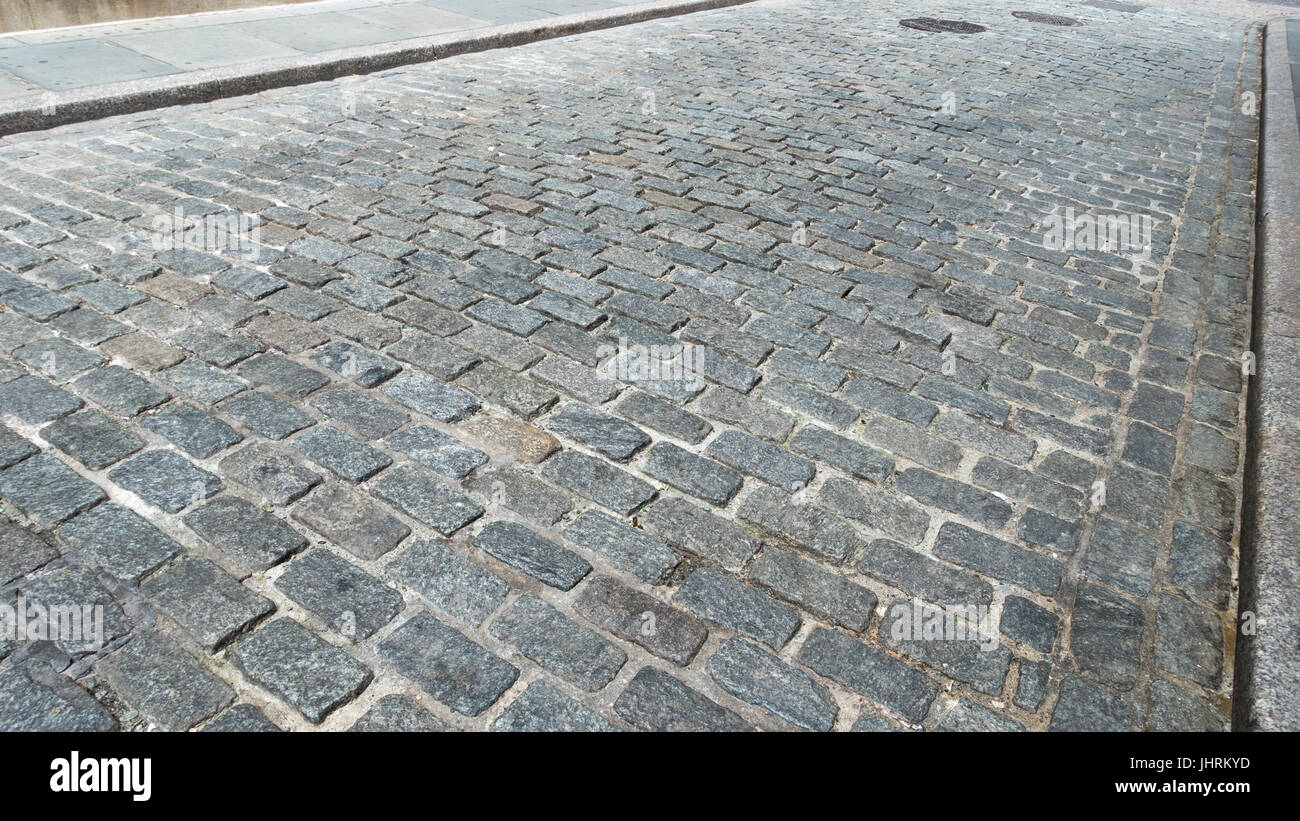 Cobblestone brick street background backdrop Stock Photo - Alamy