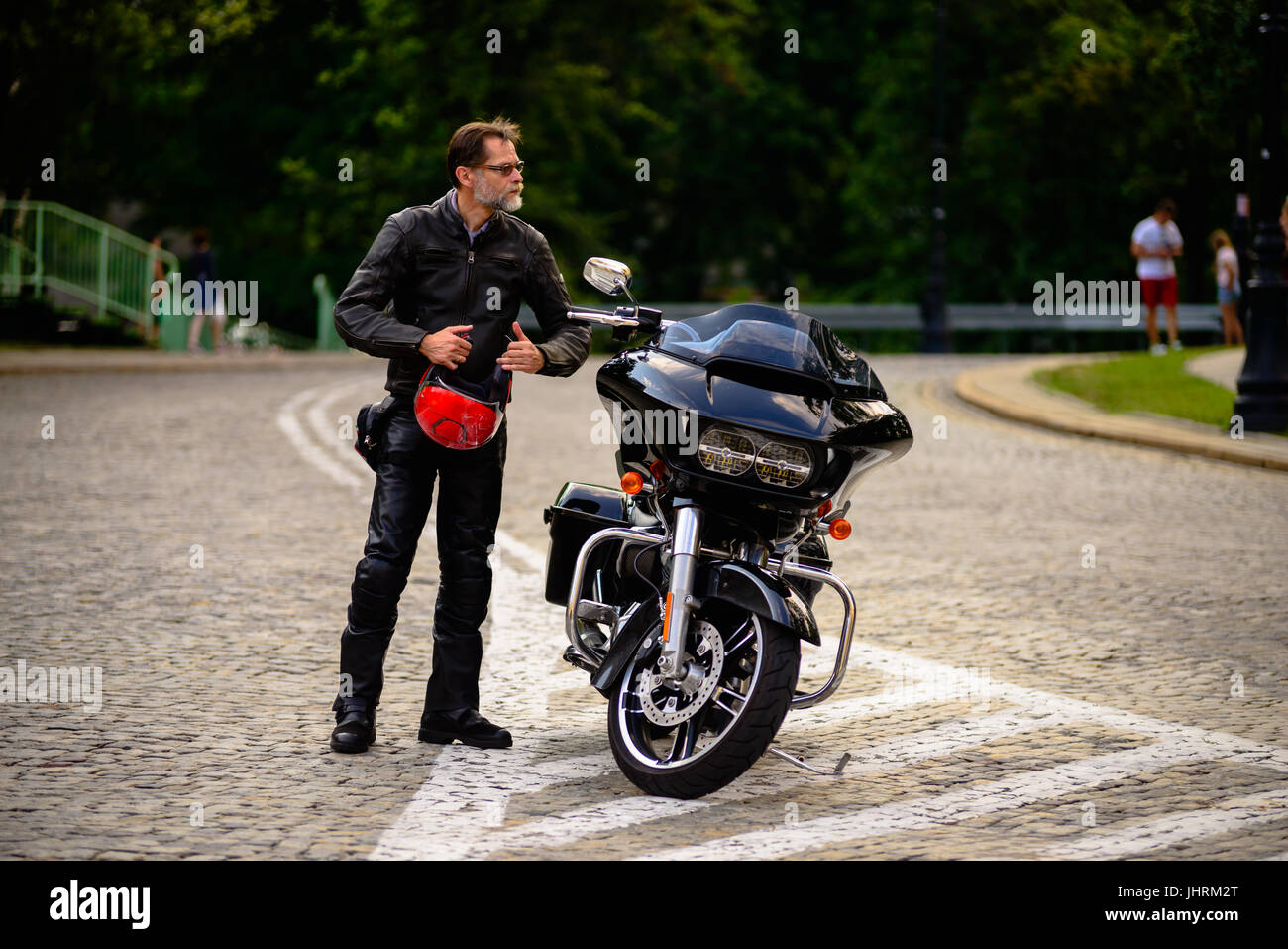 Black Custom Motorbike and the rider Stock Photo - Alamy