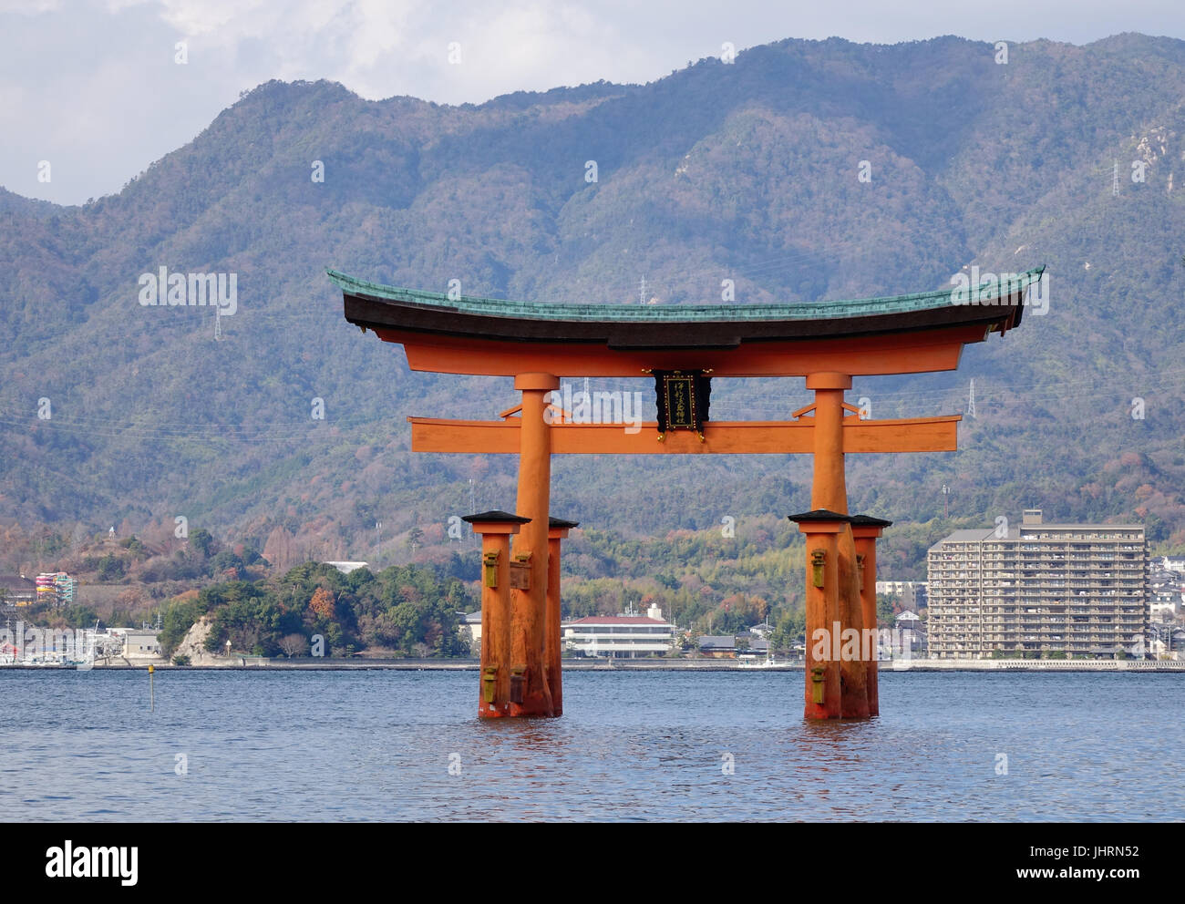 Floating gate (Giant Torii) of Itsukushima Shrine with cityscape ...
