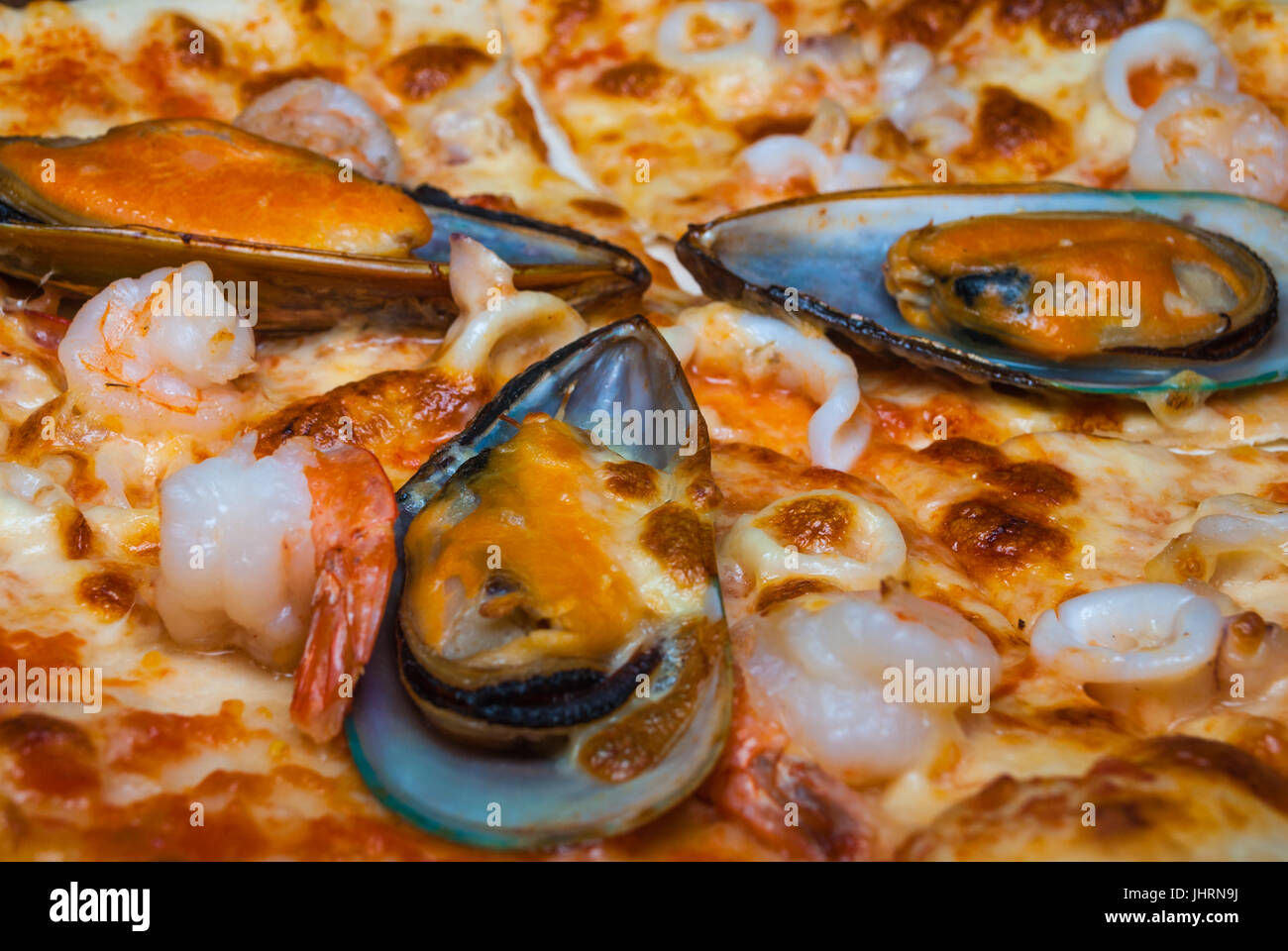 Closeup to Yummy Seafood Topping Pizza Background Stock Photo - Alamy