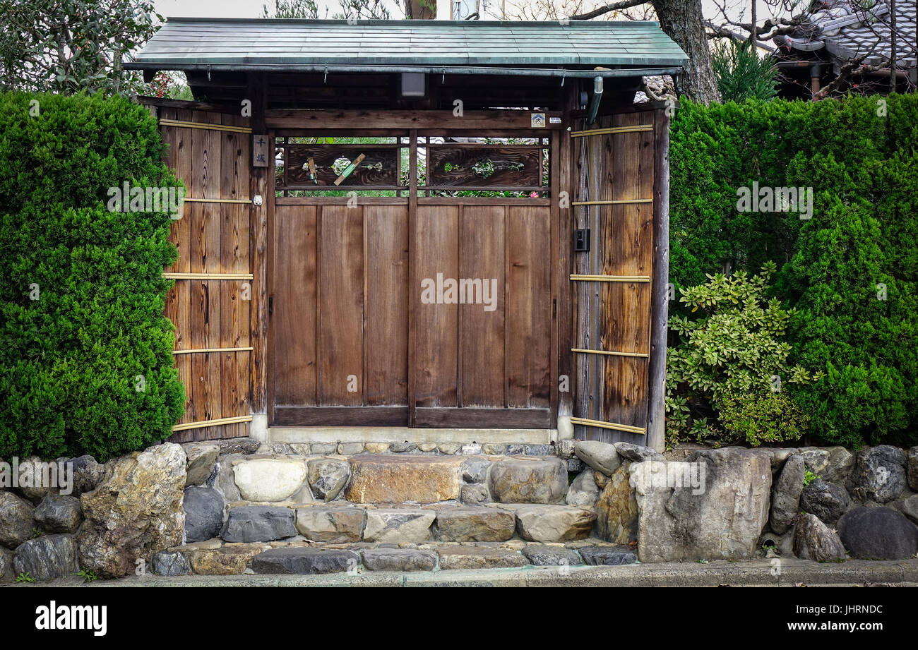 A wooden gate of the ancient palace at sunny day in Kyoto, Japan. Kyoto ...