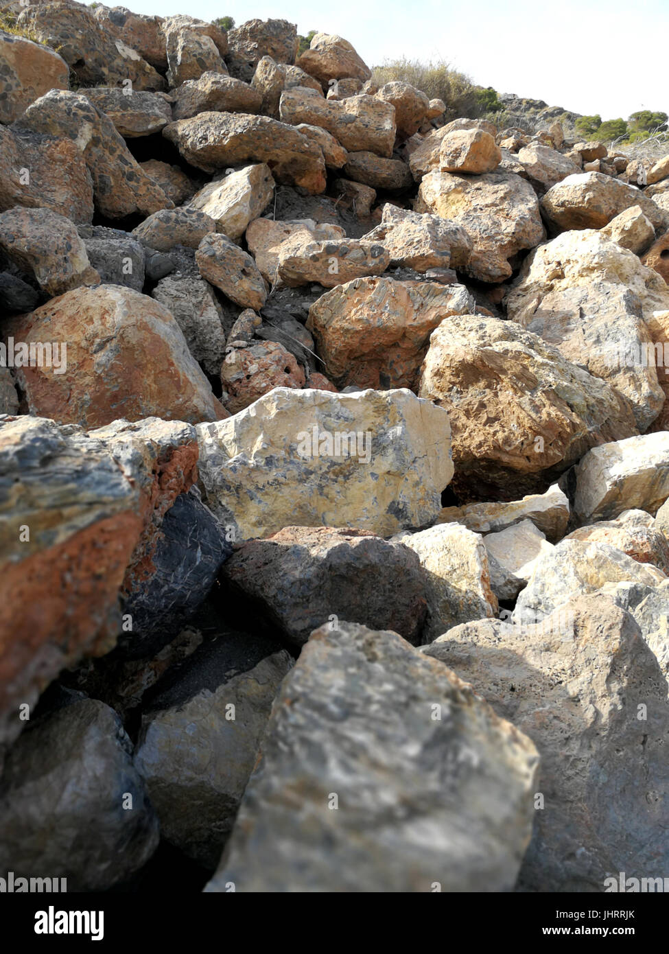 Huge stacked rocks breakwater Stock Photo - Alamy