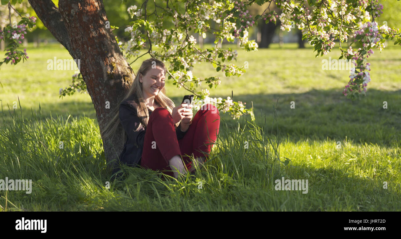 Sitting under the apple tree hi-res stock photography and images - Alamy