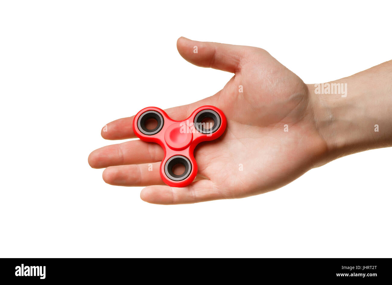 The red spinner is in hand. Hand isolated on white background Stock ...