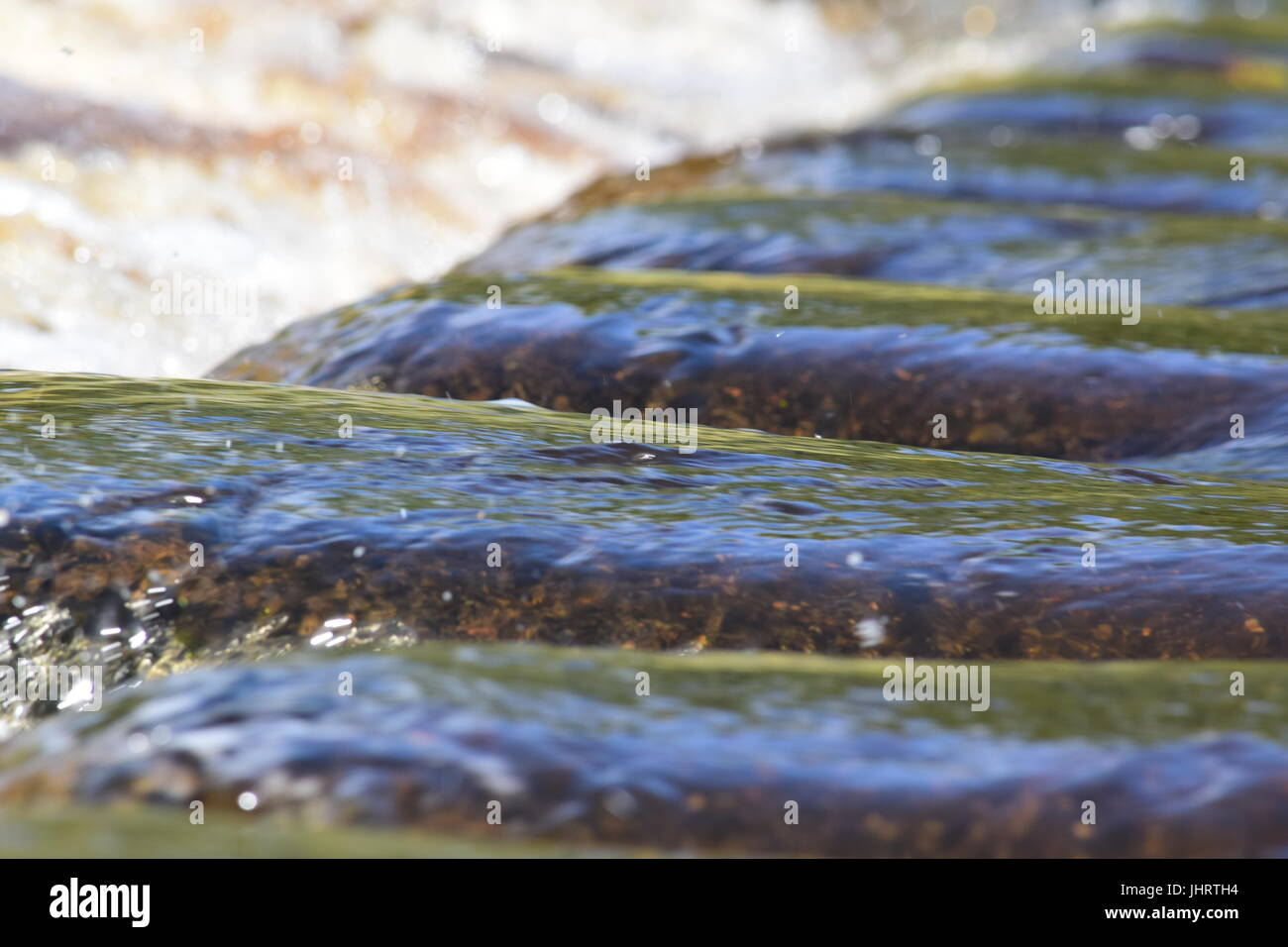 Water over weir Stock Photo - Alamy