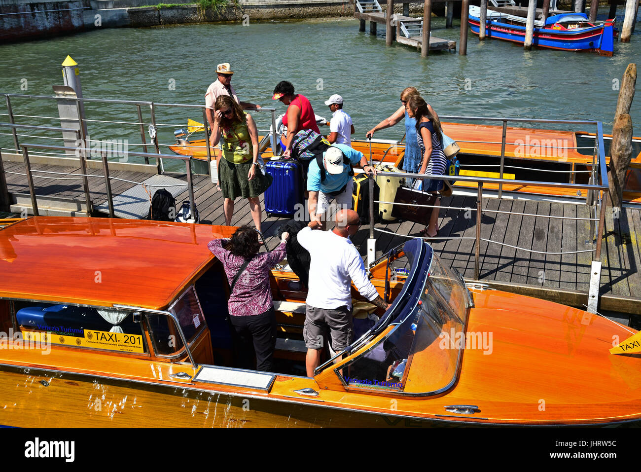 tourist using watertaxi,venice,italy Stock Photo - Alamy