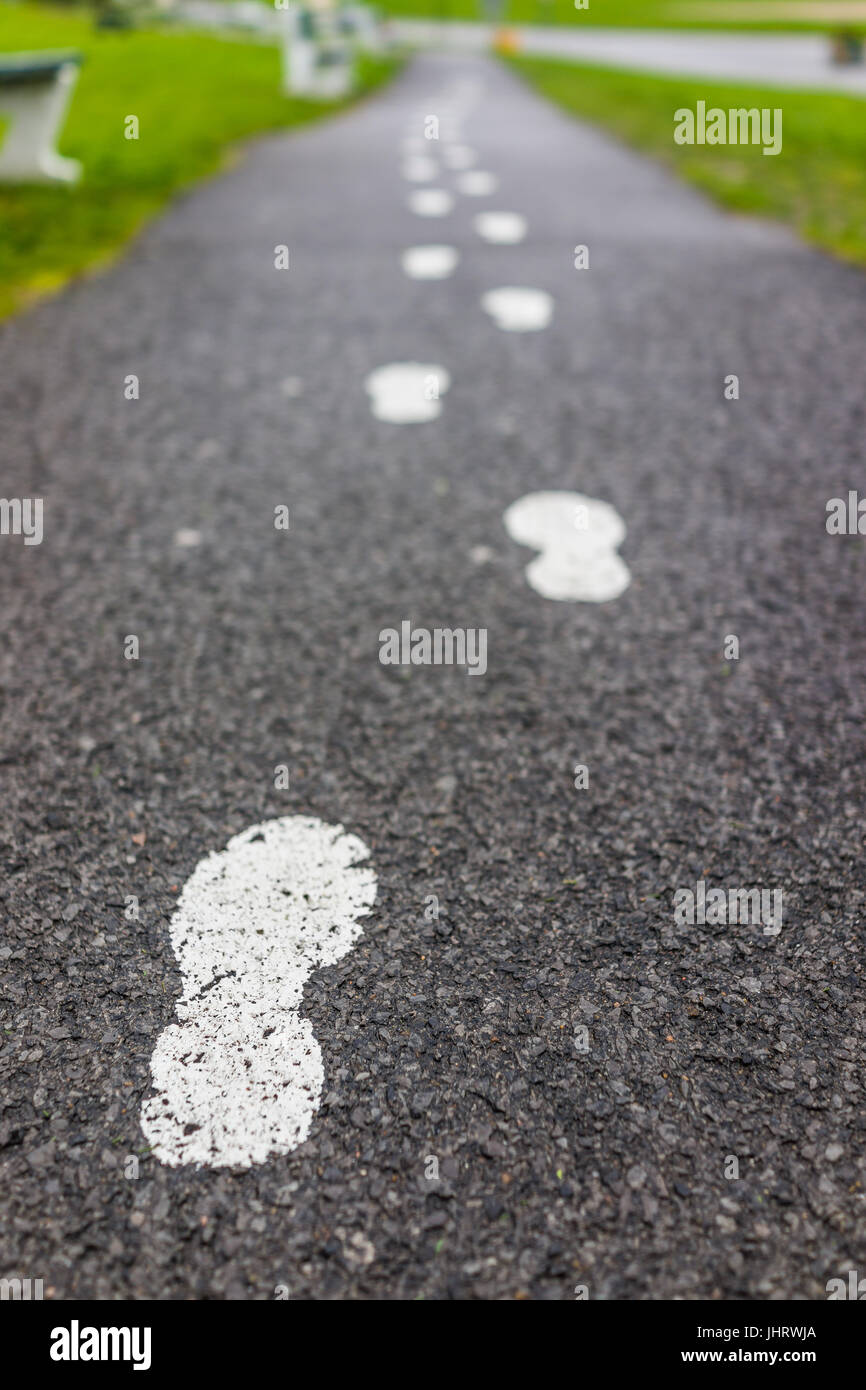 White footprints on asphalt hi-res stock photography and images - Alamy