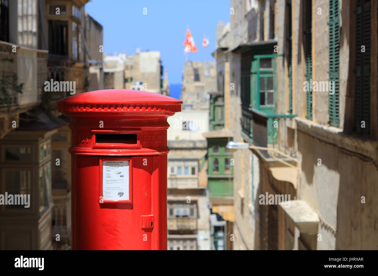Red, British style letterbox on the steps of M.A. Vassalli Street, in ...
