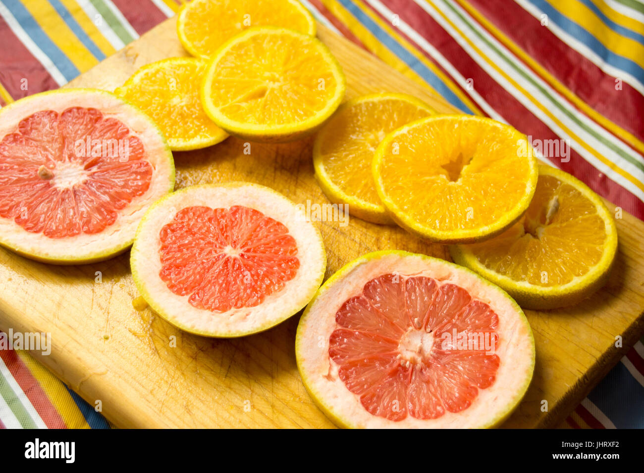 Photograph of some grapefruit and orange slices Stock Photo - Alamy