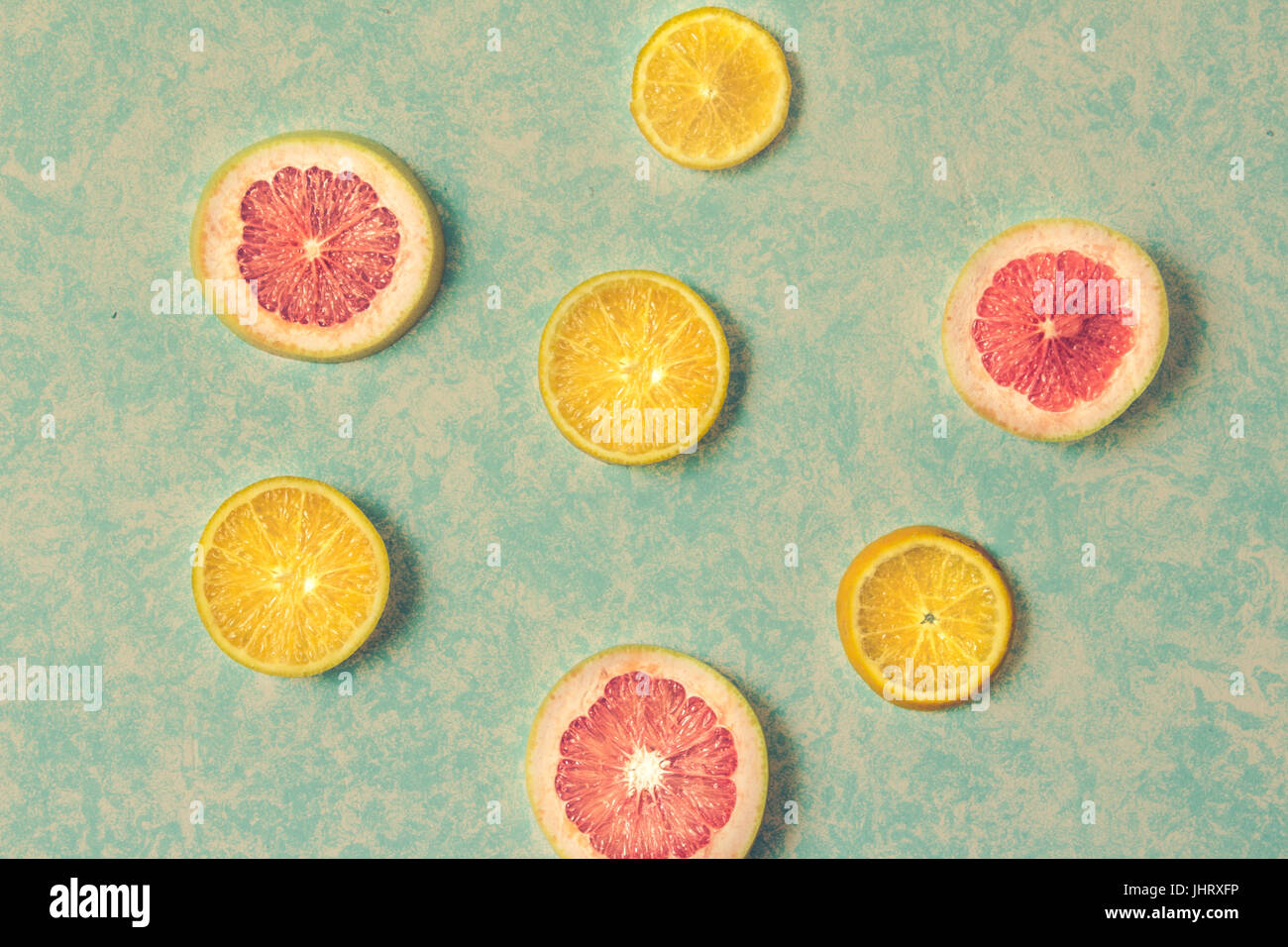 Photograph of some grapefruit slices on light blue background Stock ...