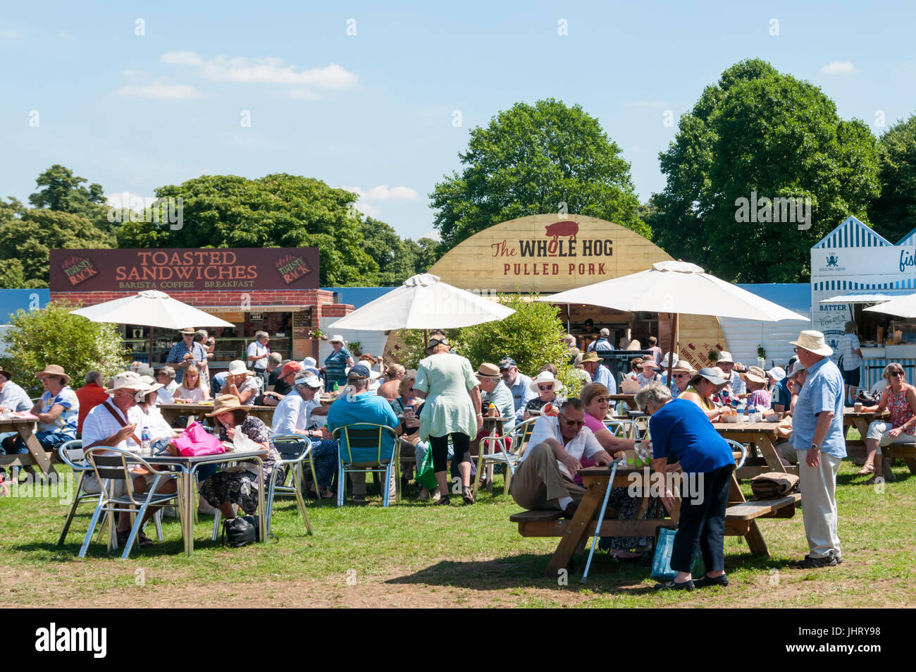 Tables and chairs outside refreshment stalls at the 2017 Hampton Court ...