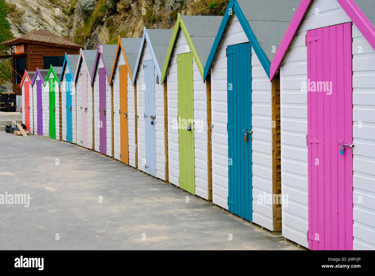 Row of pastel coloured Beach huts at Newquay in Cornwall Stock Photo ...
