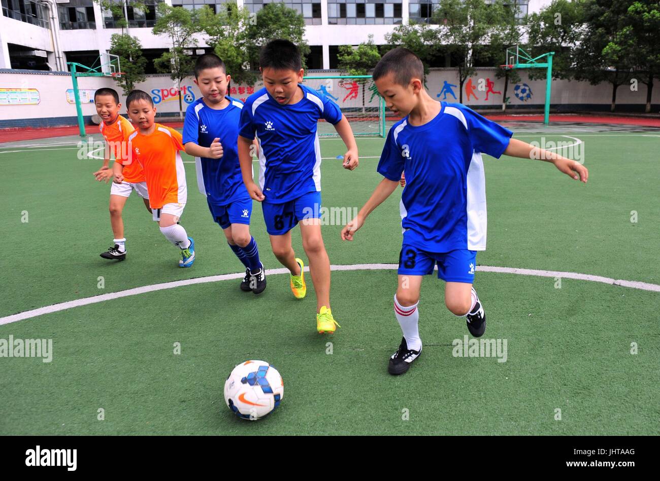 Zigui, China's Hubei Province. 16th July, 2017. Children play football ...