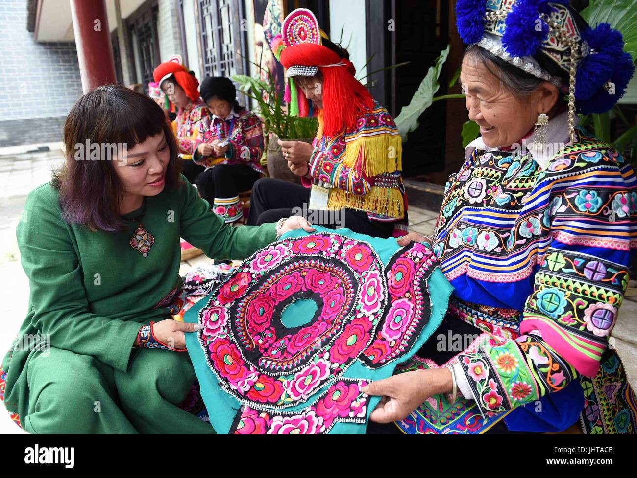 Chuxiong, China's Yunnan Province. 16th July, 2017. A woman of Yi ...