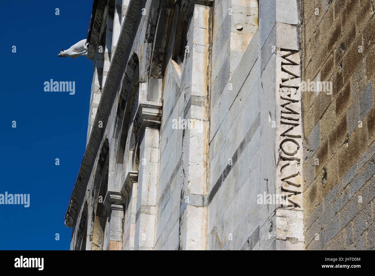 Ancient graffiti Mae Minorum (mae minorvm) on side wall of cathedral in ...
