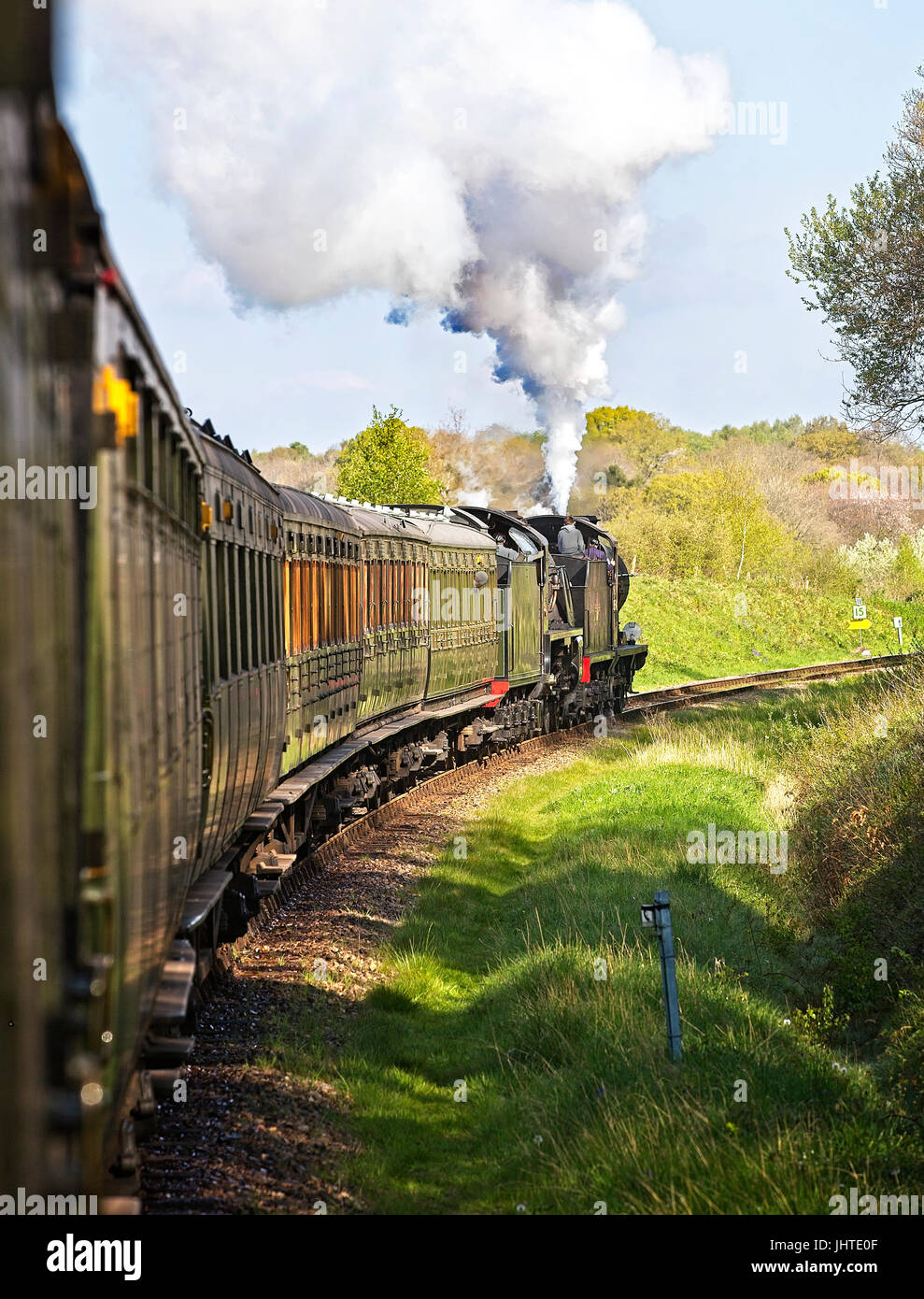 Two steam locomotives double-heading a passenger train, West Sussex ...