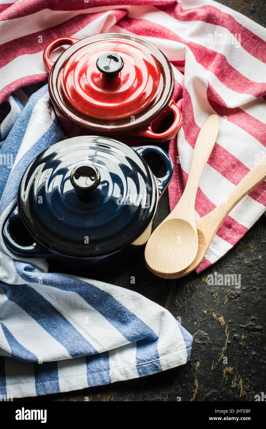 Cooking pot and napkin on rustic woodn background Stock Photo - Alamy
