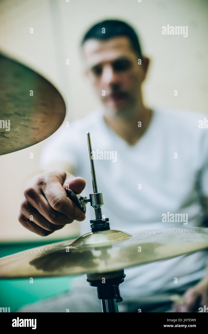 Behind the scene. Male drummer artist musician playing the drums with ...