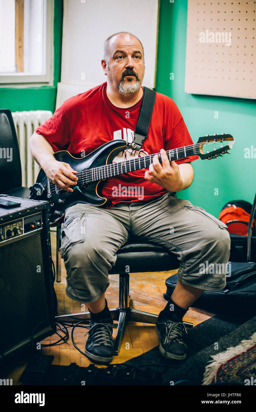 Behind the scene. Male guitarist artist musician practice playing ...