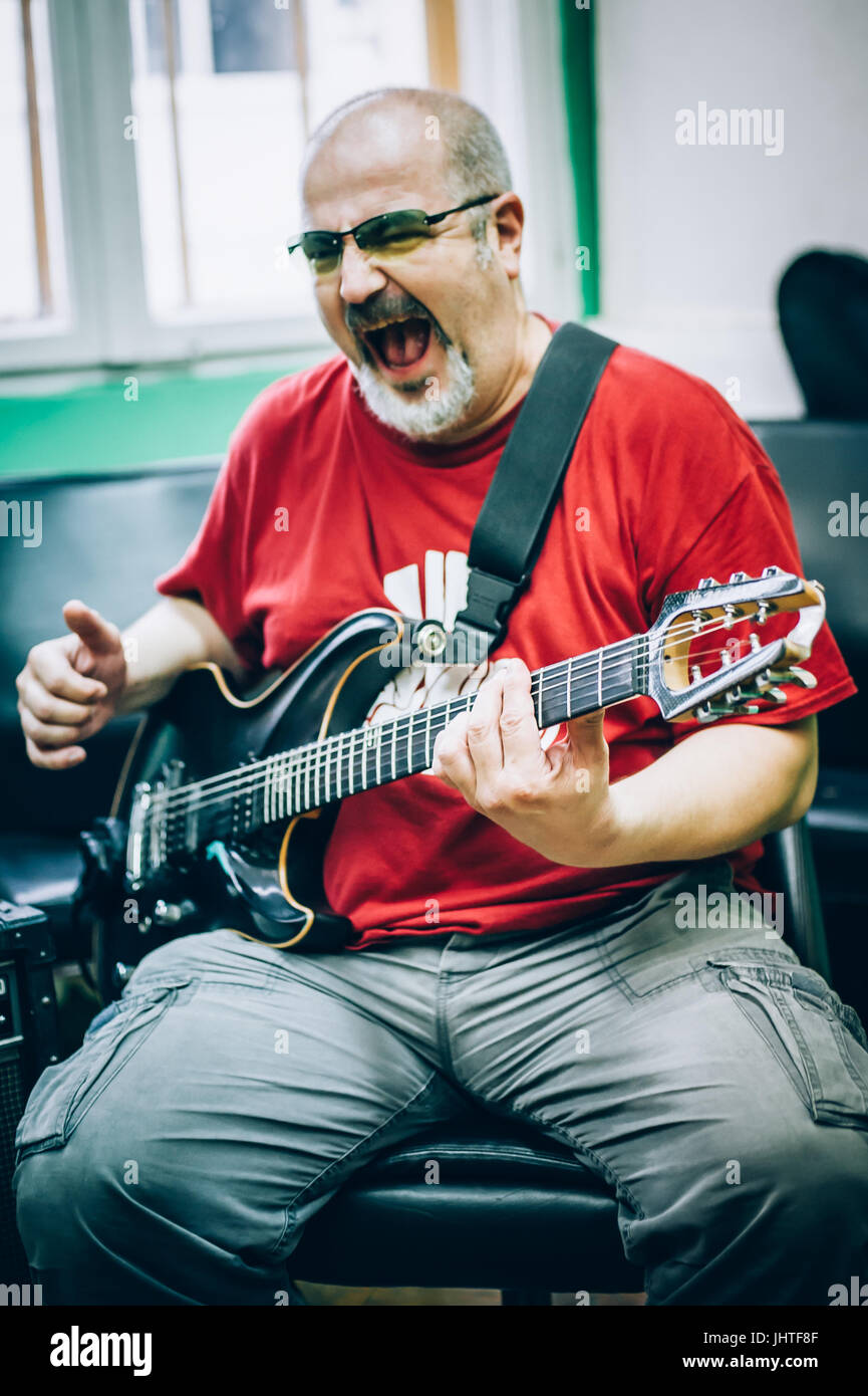 Behind the scene. Male guitarist artist musician practice playing ...