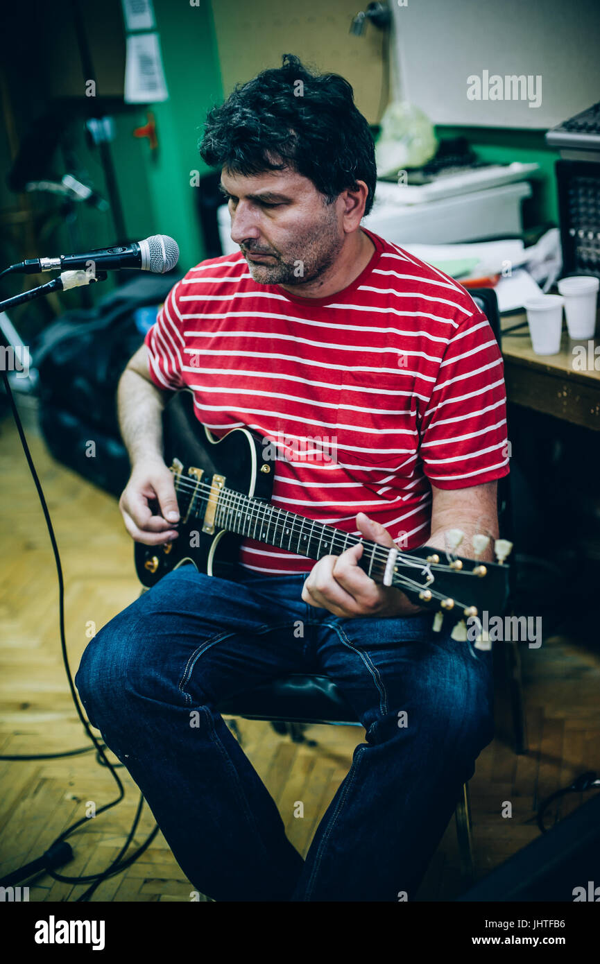 Behind the scene. Male guitarist artist musician practice playing ...