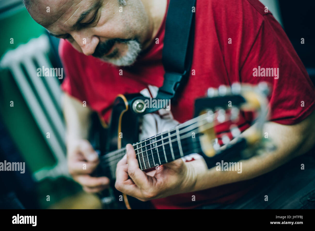 Behind the scene. Male guitarist artist musician practice playing ...