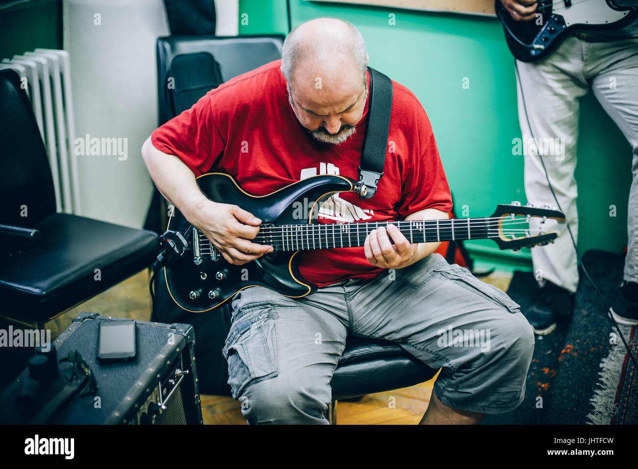 Behind the scene. Male guitarist artist musician practice playing ...