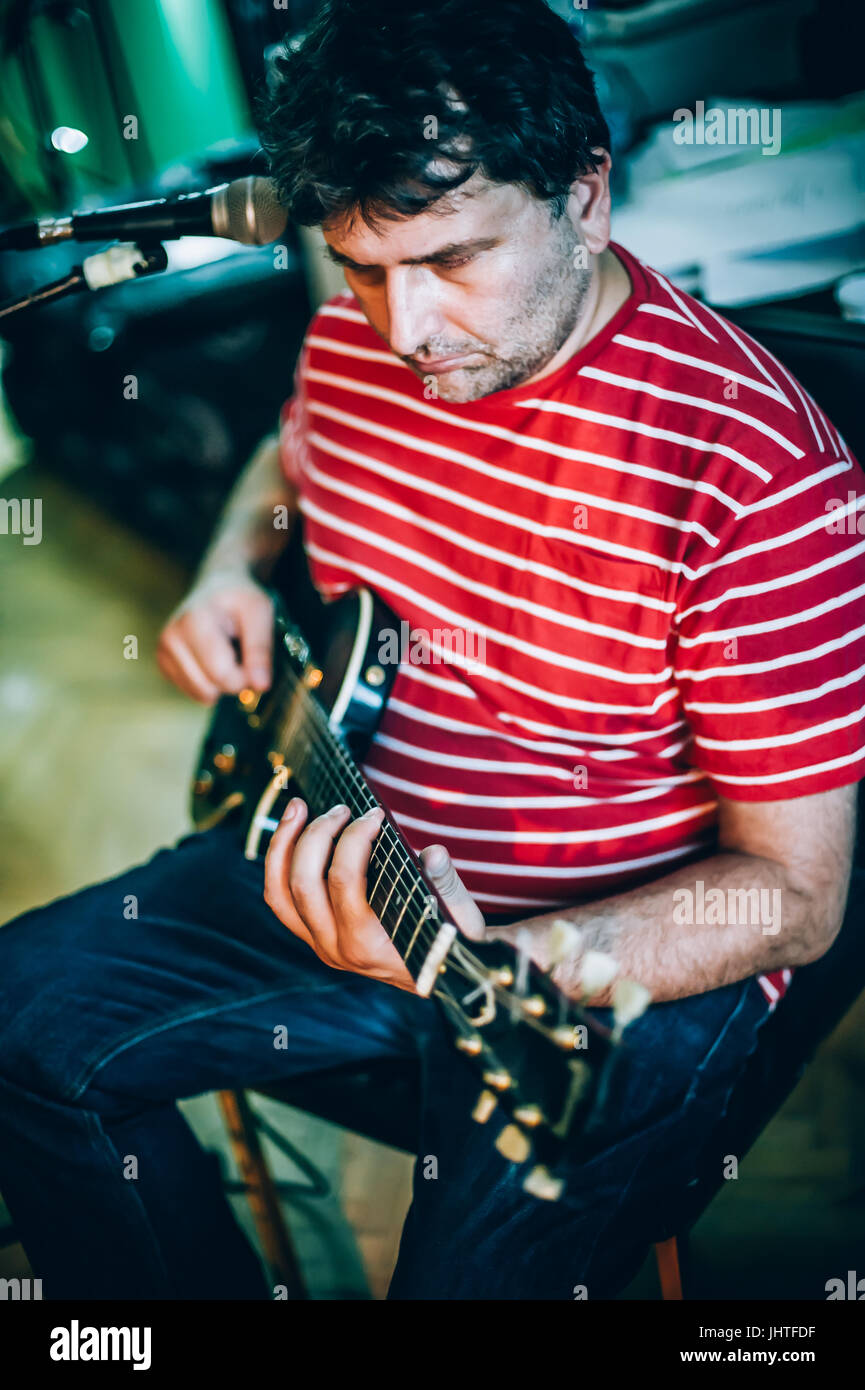 Behind the scene. Male guitarist artist musician practice playing ...