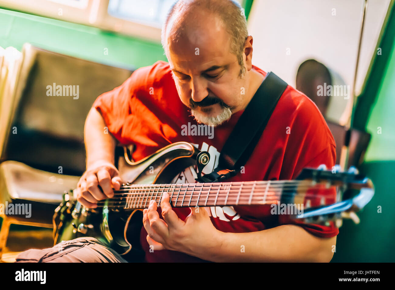 Behind the scene. Male guitarist artist musician practice playing ...