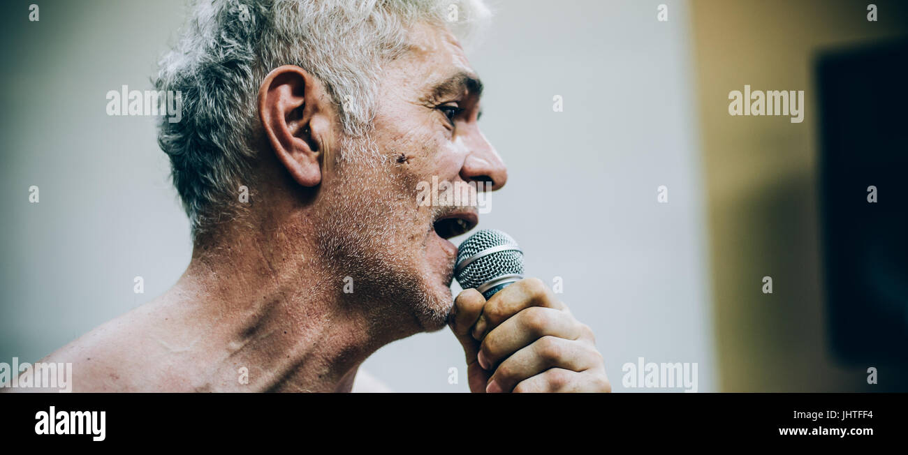 Behind the scene. Famous alternative male singer practice singing on ...