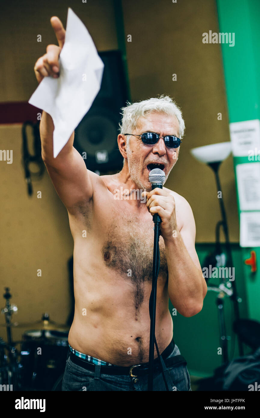 Behind the scene. Famous alternative male singer practice singing on ...