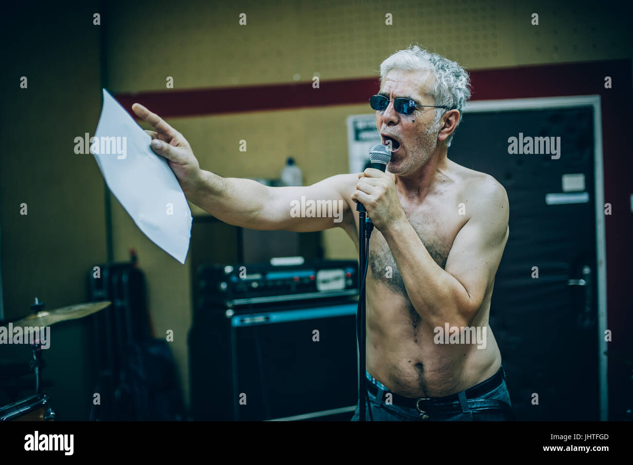 Man behind microphone in studio hi-res stock photography and images - Alamy