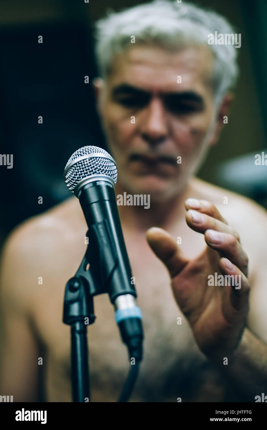 Behind the scene. Famous alternative male singer practice singing on ...