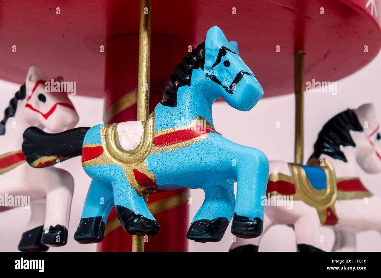 Colored carousel toy with horses, close up, isolated, white background ...
