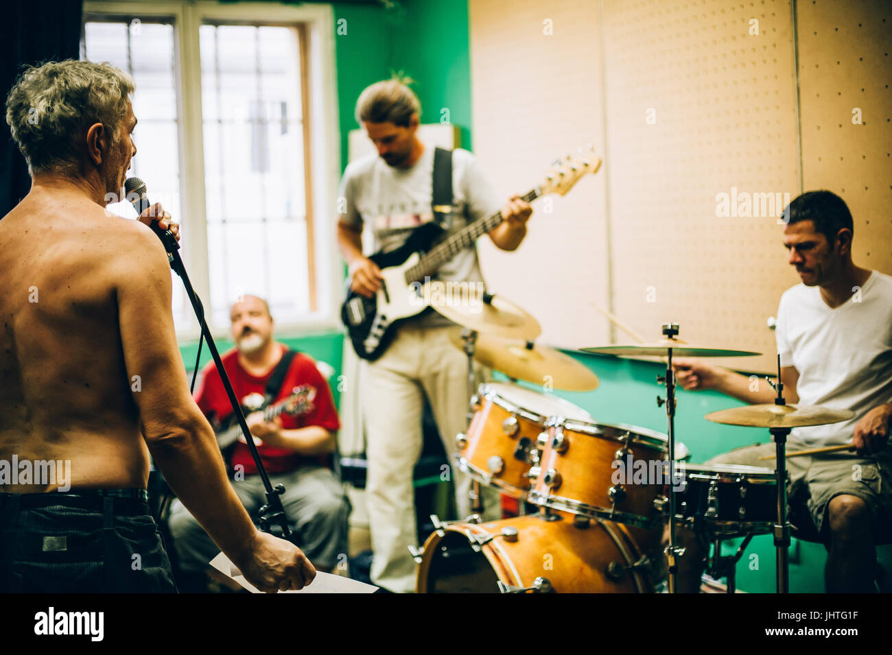 Behind the scene. Rock band practice in the messy recording music ...