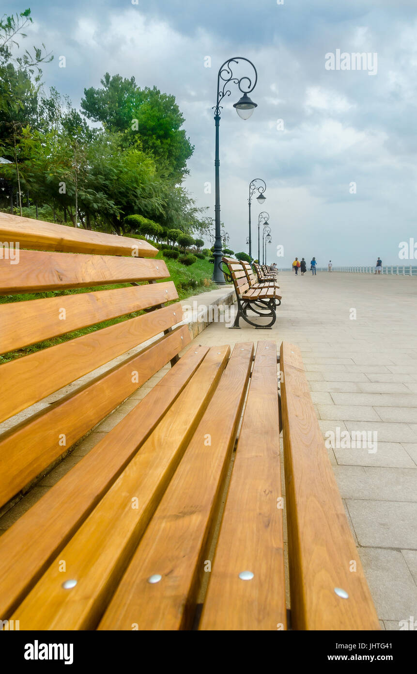 The Black Sea beach, seaside (seafront) with colored benches and ...