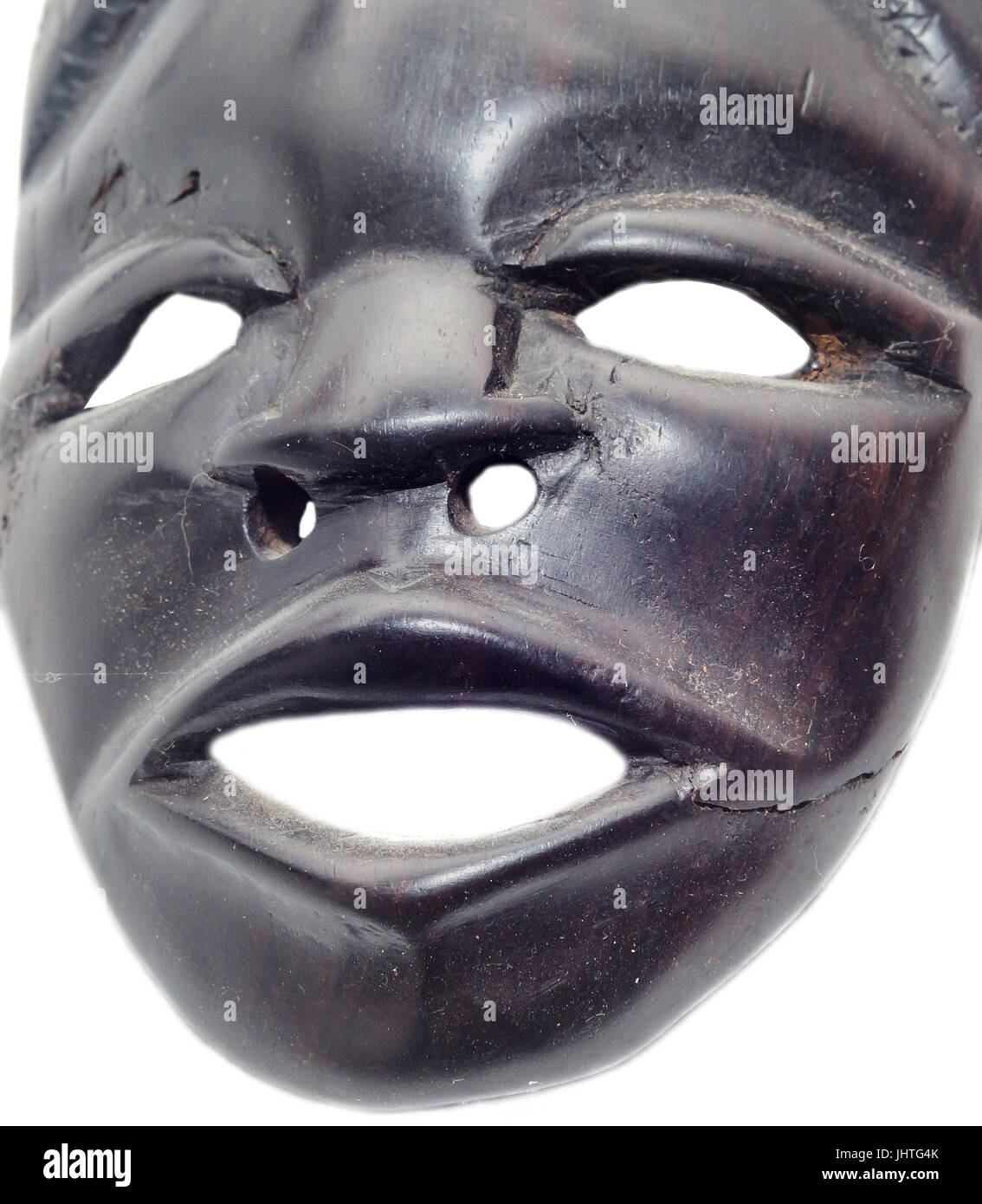 Black african wood mask, halloween mask, close up, isolated Stock Photo ...