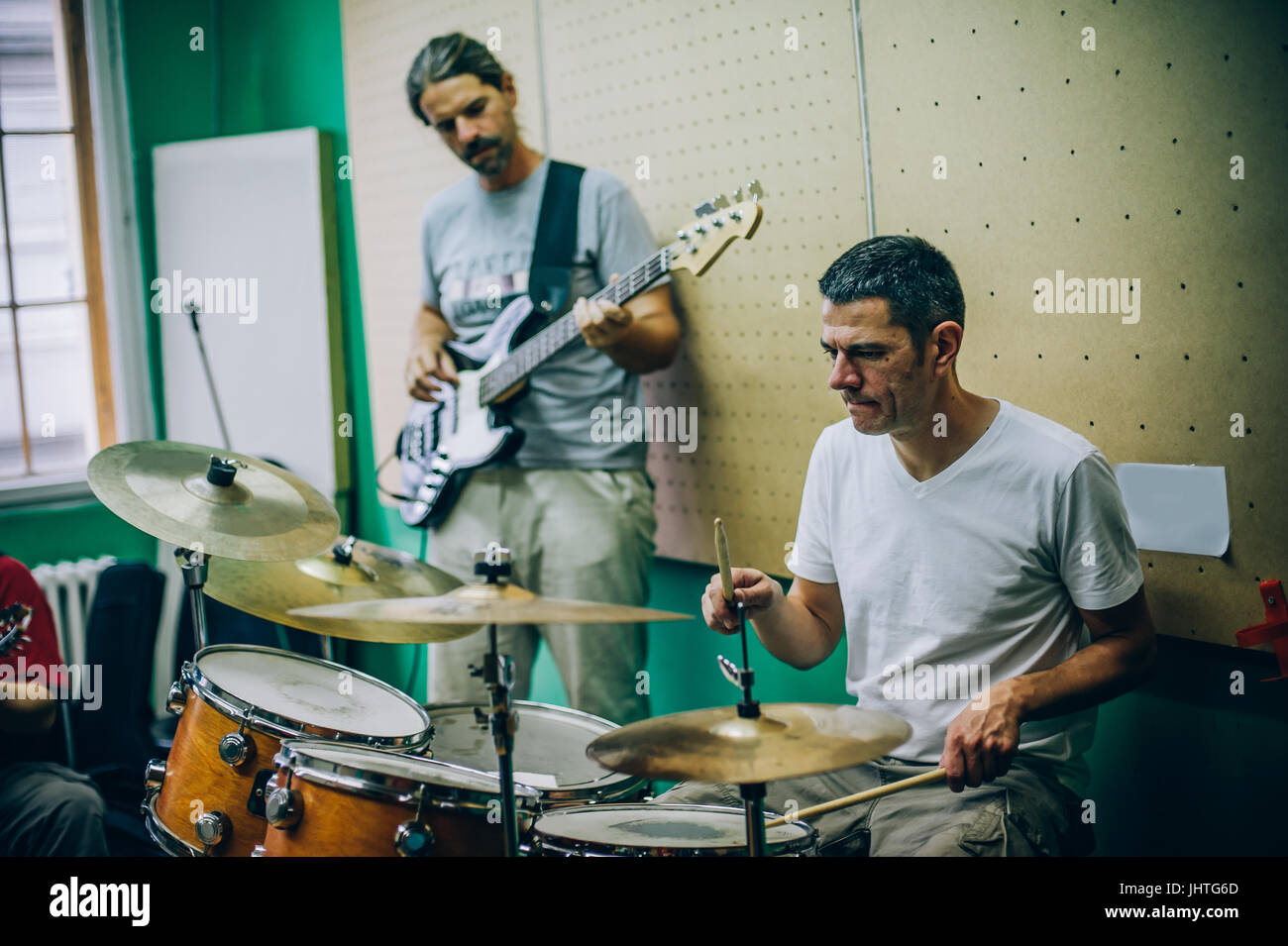 Behind the scene. Rock band practice in the messy recording music ...