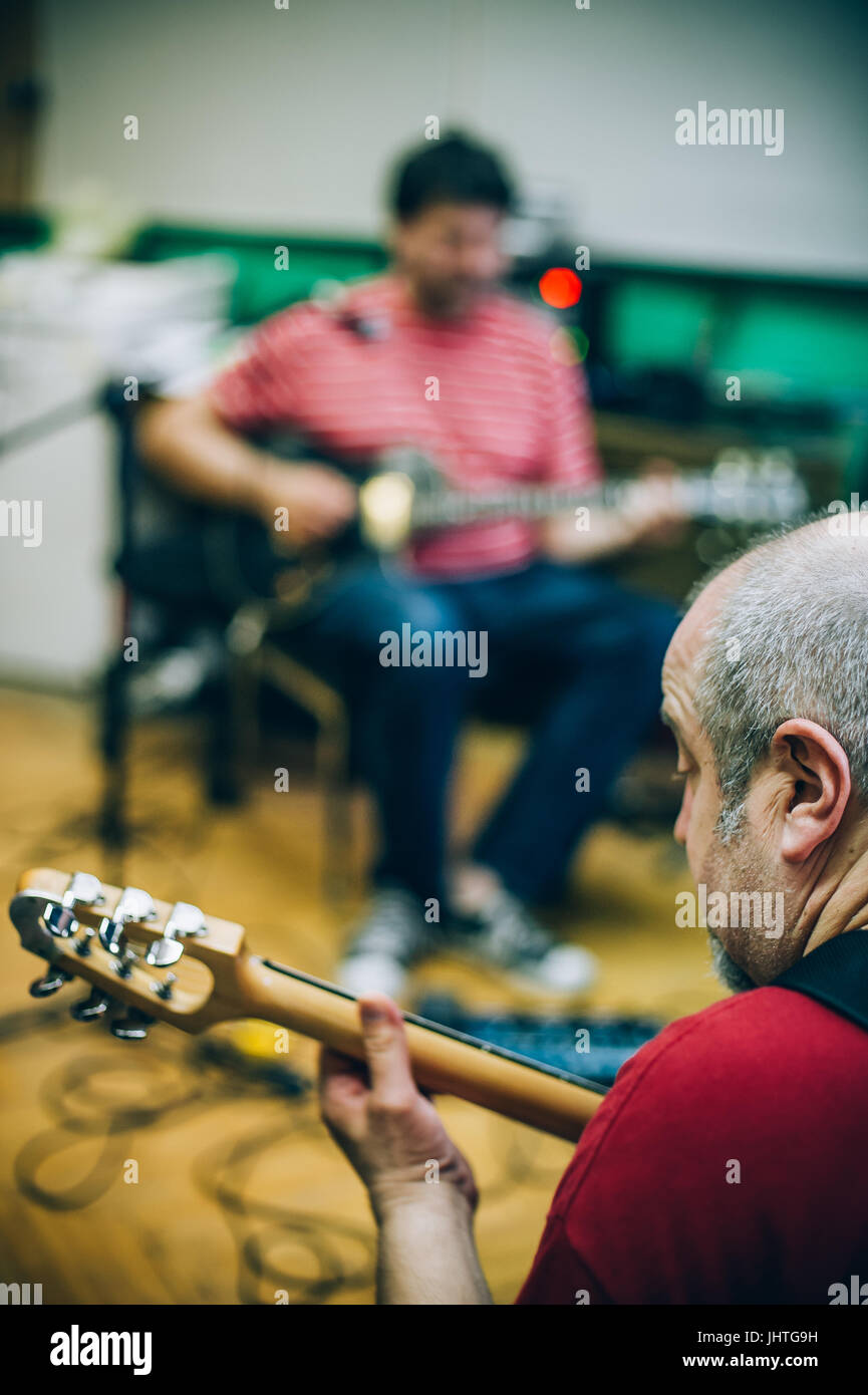 Behind the scene. Rock band practice in the messy recording music ...
