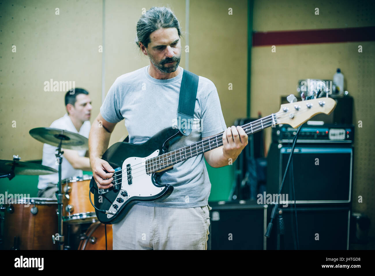 Behind the scene. Rock band practice in the messy recording music ...