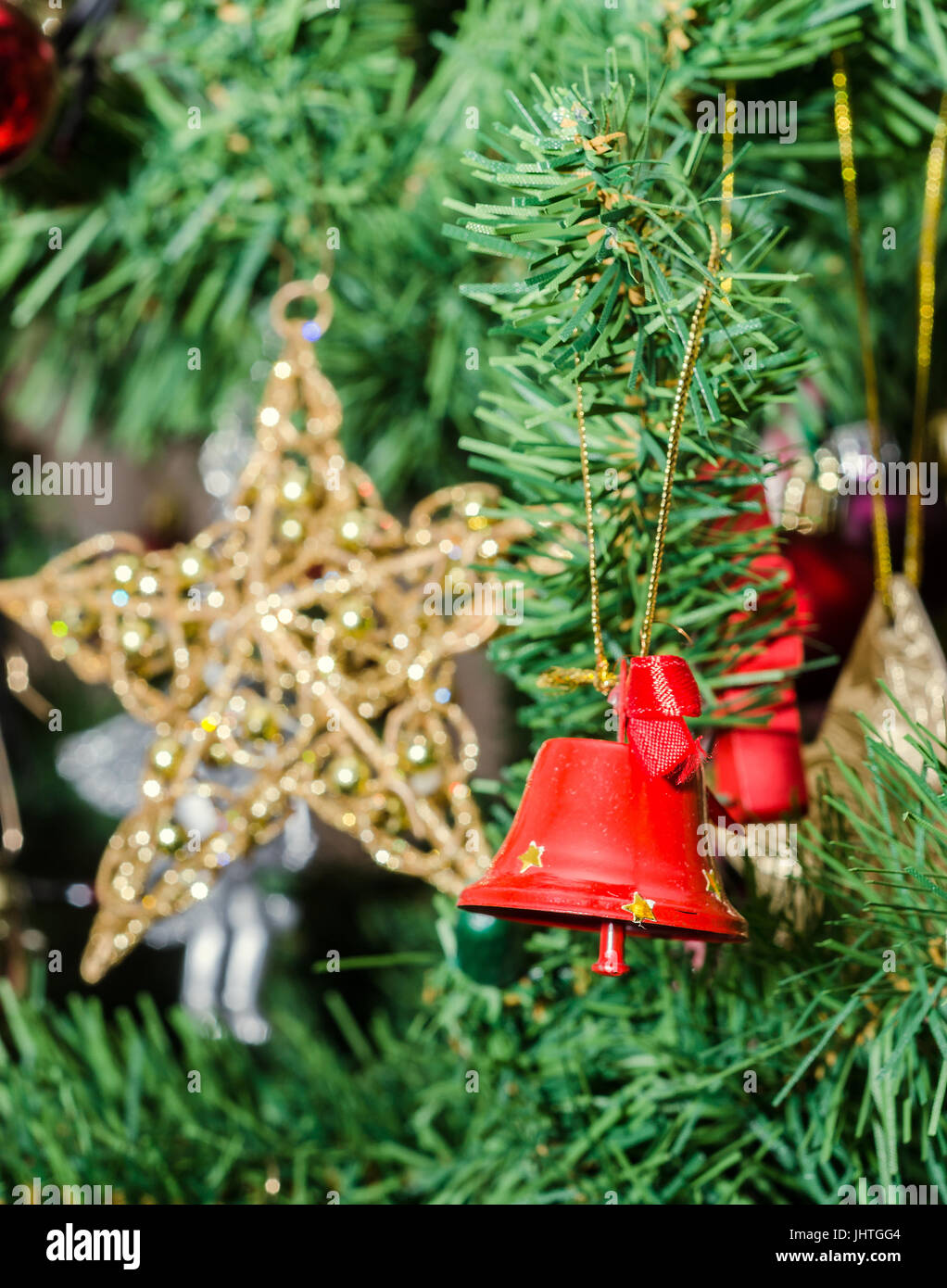Detail of green Christmas (Chrismas) tree with colored ornaments ...
