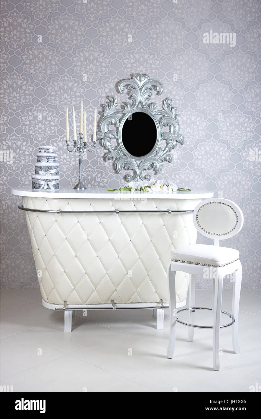 white bar rack in the Baroque style in the fashion studio. rich ...