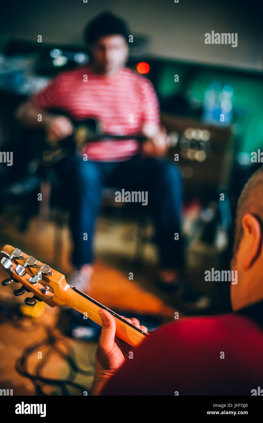 Behind the scene. Rock band practice in the messy recording music ...