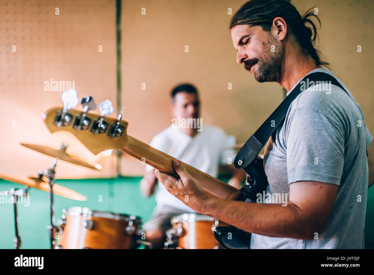Behind the scene. Rock band practice in the messy recording music ...
