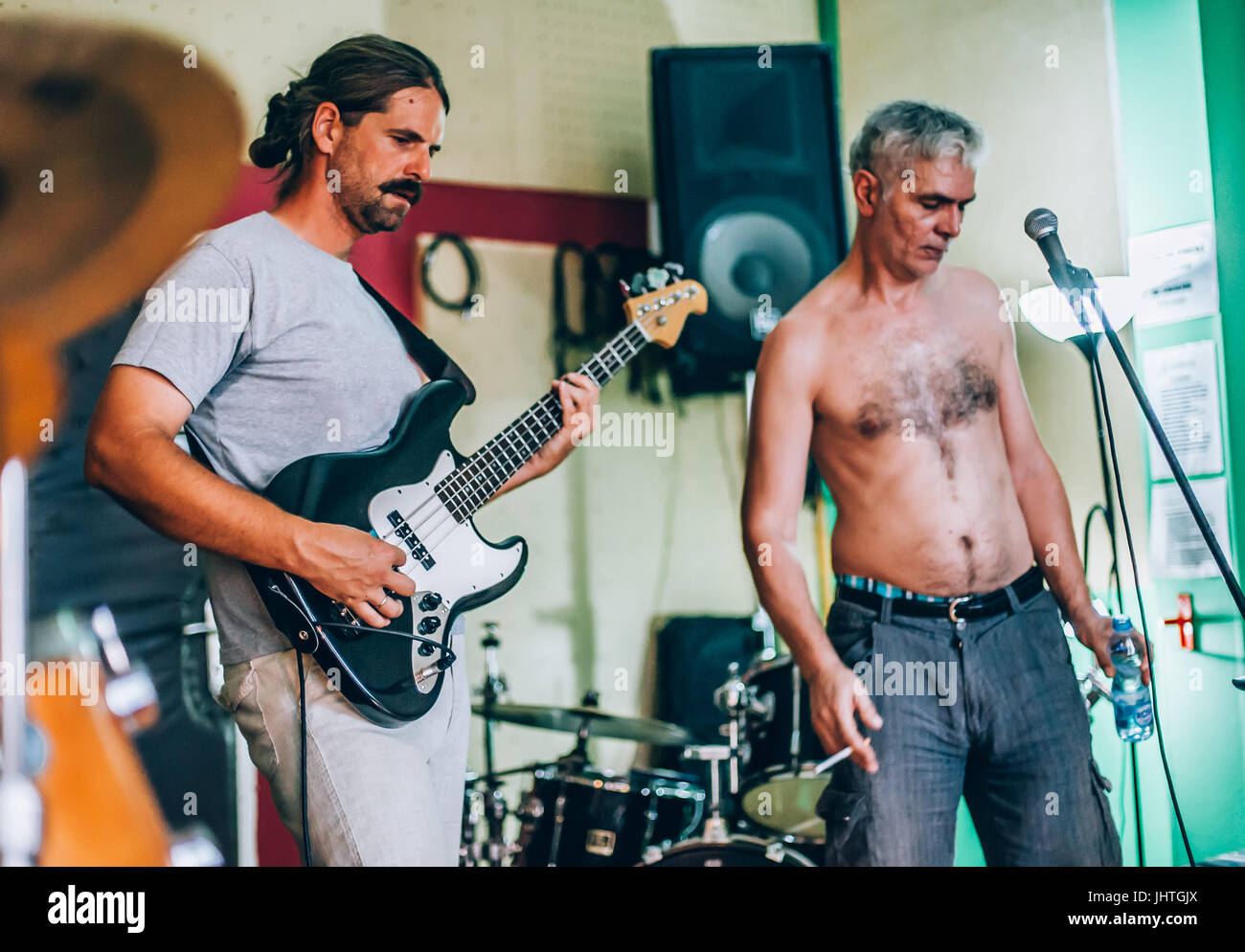 Behind the scene. Rock band practice in the messy recording music ...