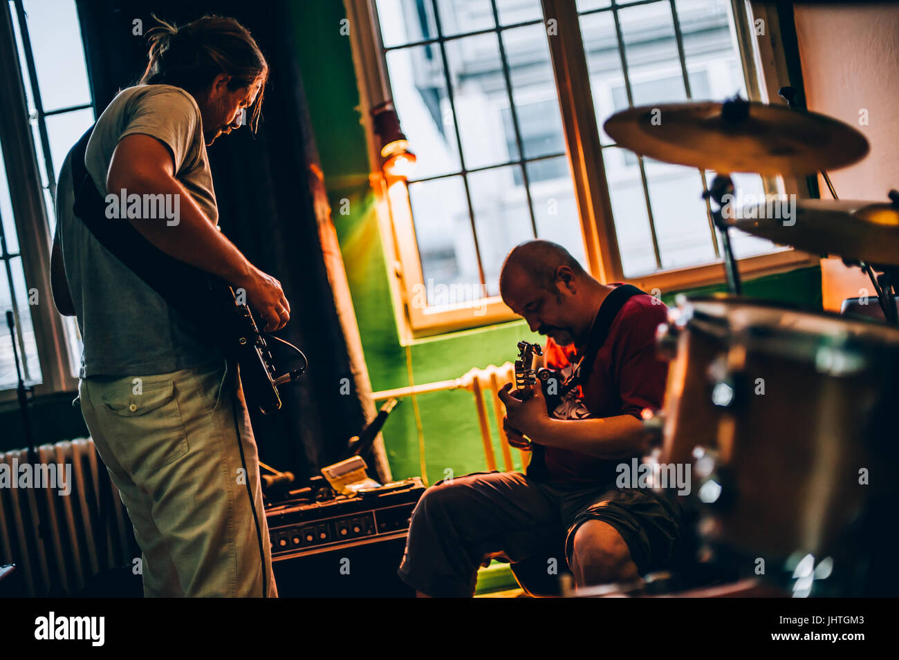 Behind the scene. Rock band practice in the messy recording music ...