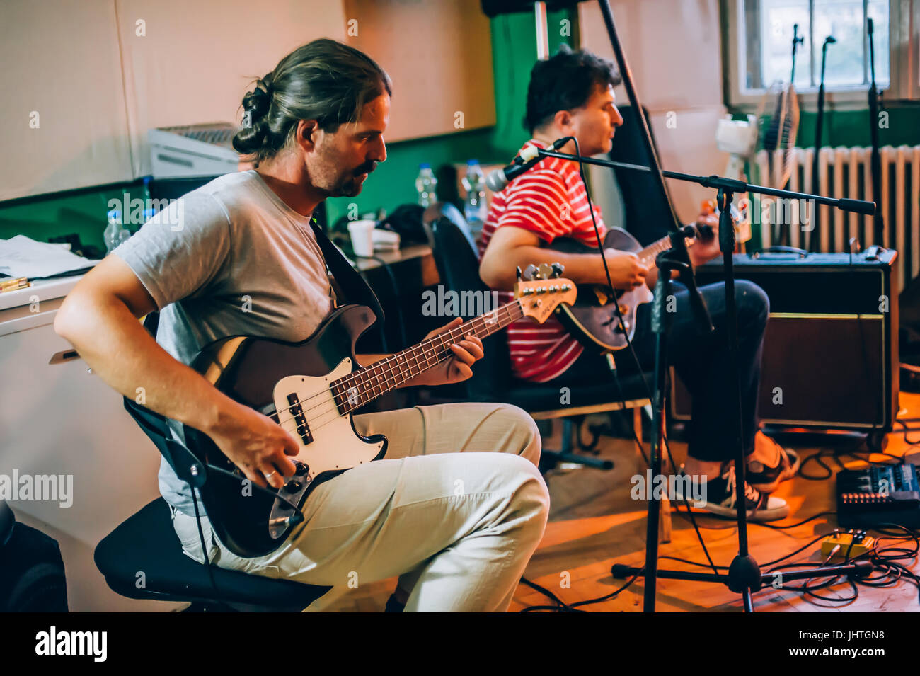 Behind the scene. Rock band practice in the messy recording music ...