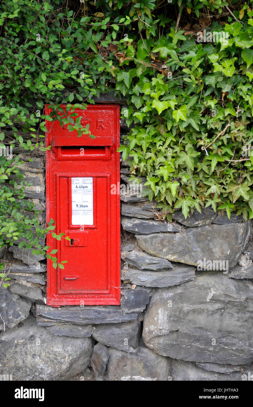 Victorian red post office mail box set into a stone wall Stock Photo ...
